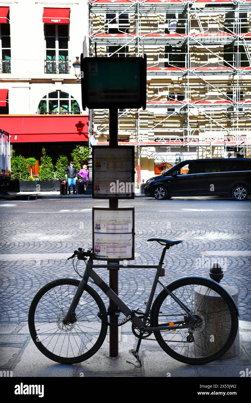 Bicycle parked on a bus stop - Rue Royale - Paris - France Stock Photo ...