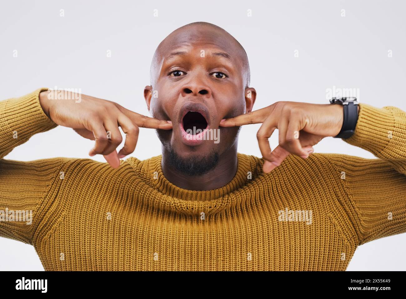 Black man, funny face or portrait in studio for comic, comedy and silly ...