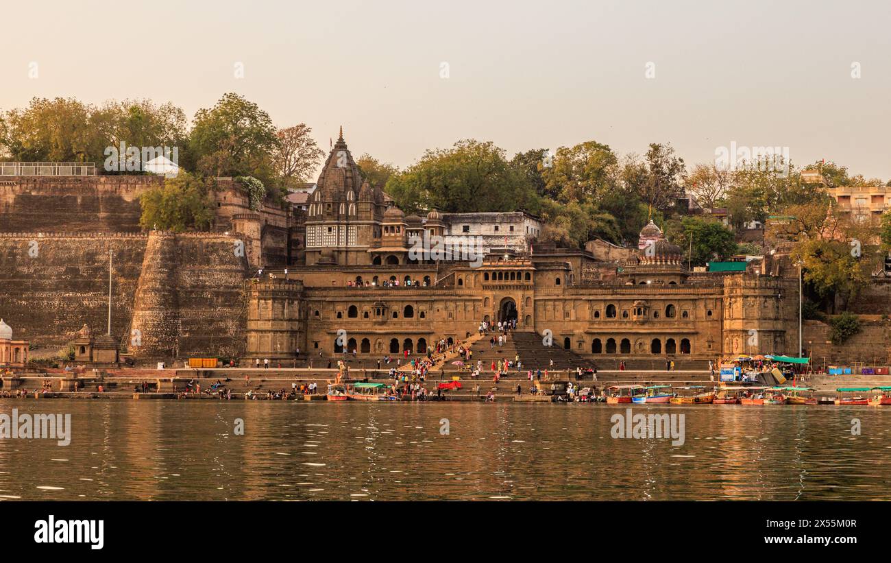 view of mahareshwa ghats and temples from the river narmada busy with ...