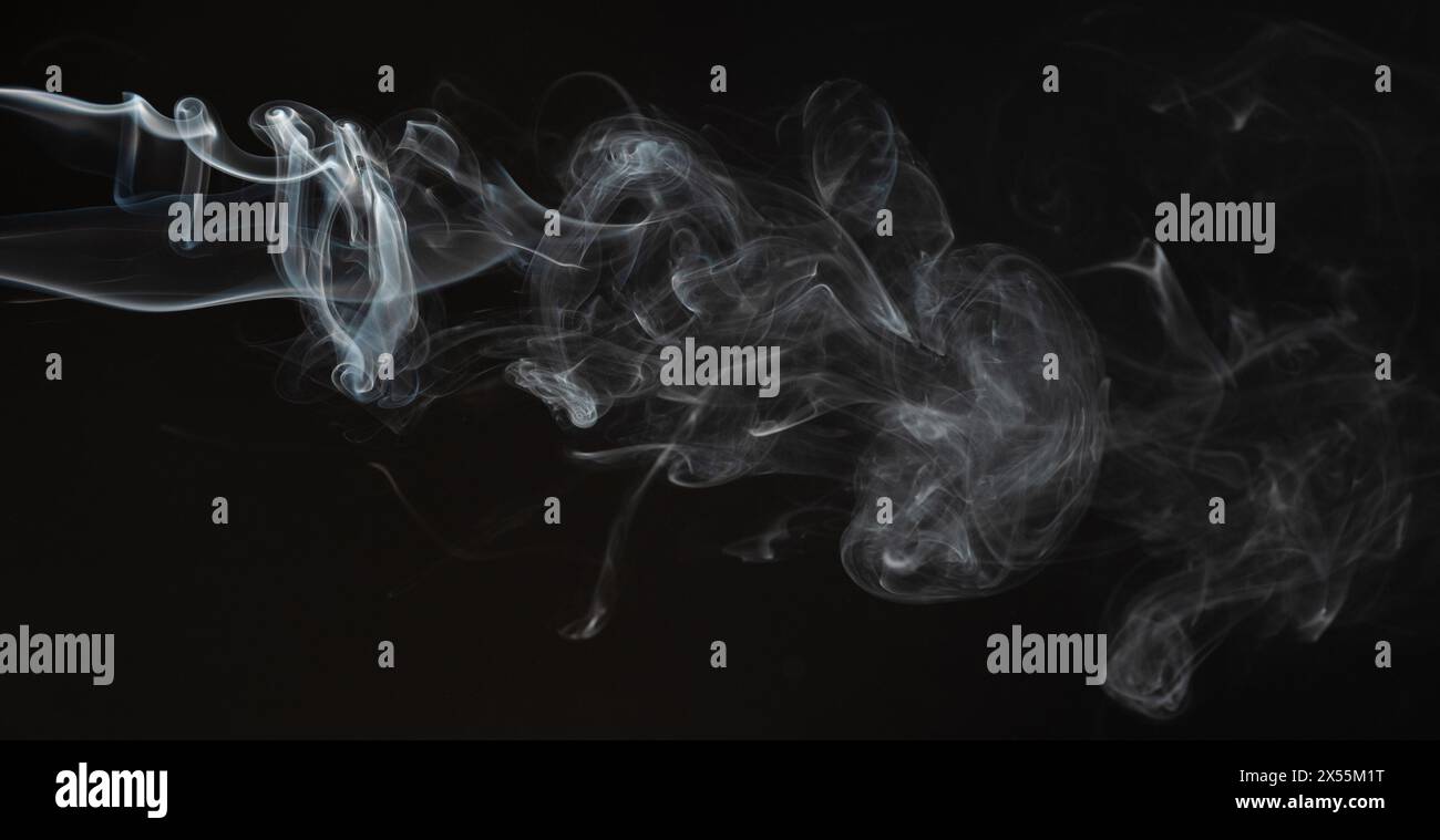 Smooth smoke swirl close up view on black background Stock Photo - Alamy