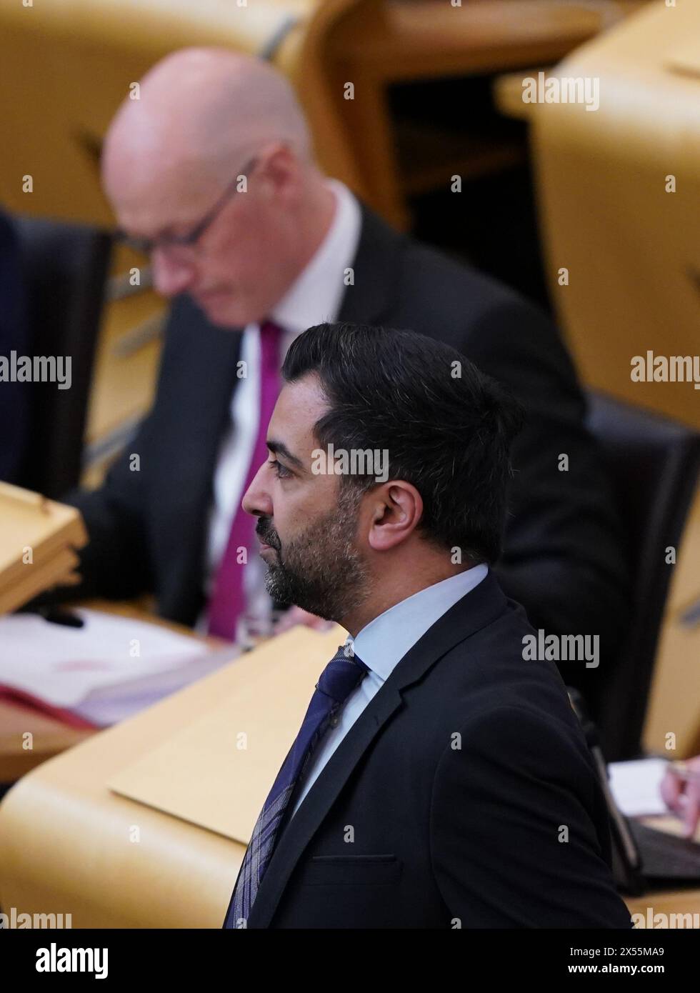 Humza Yousaf walks past newly elected leader of the Scottish National ...