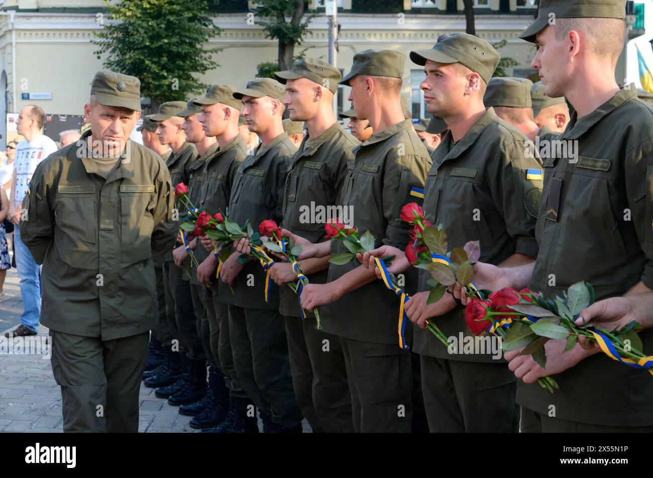 Ukrainian soldiers in military uniform standing in a rank and holding ...
