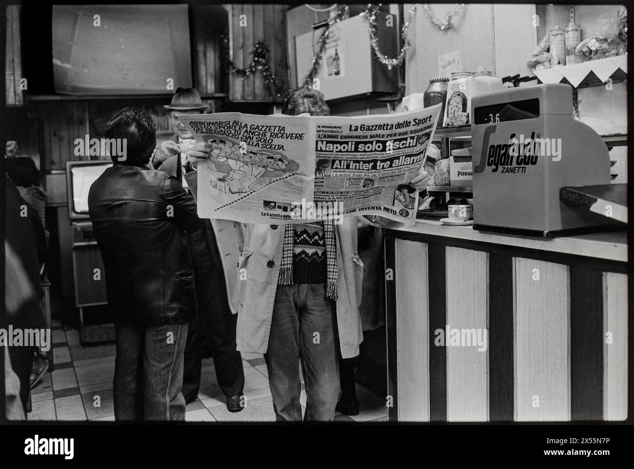 Italy Man reading a newspaper in a bar in Tuscany 1992 Stock Photo - Alamy