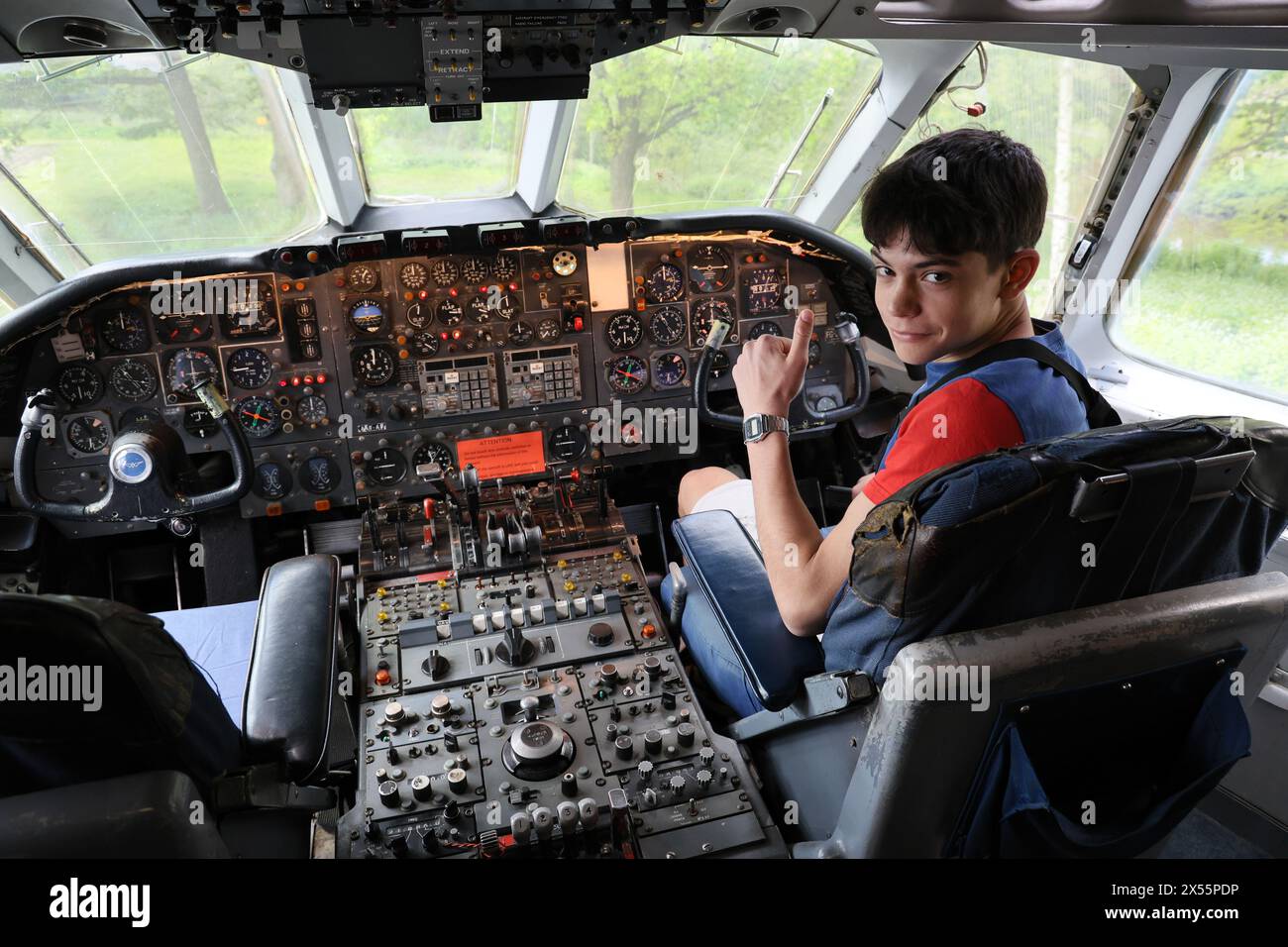 Visitor sitting in cockpit of Vickers 1103 VC10 originally owned by the ...