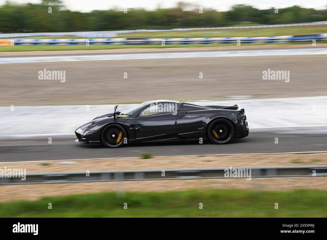 Pagani Huayra Roadster driving around track at Italian Car Day at ...