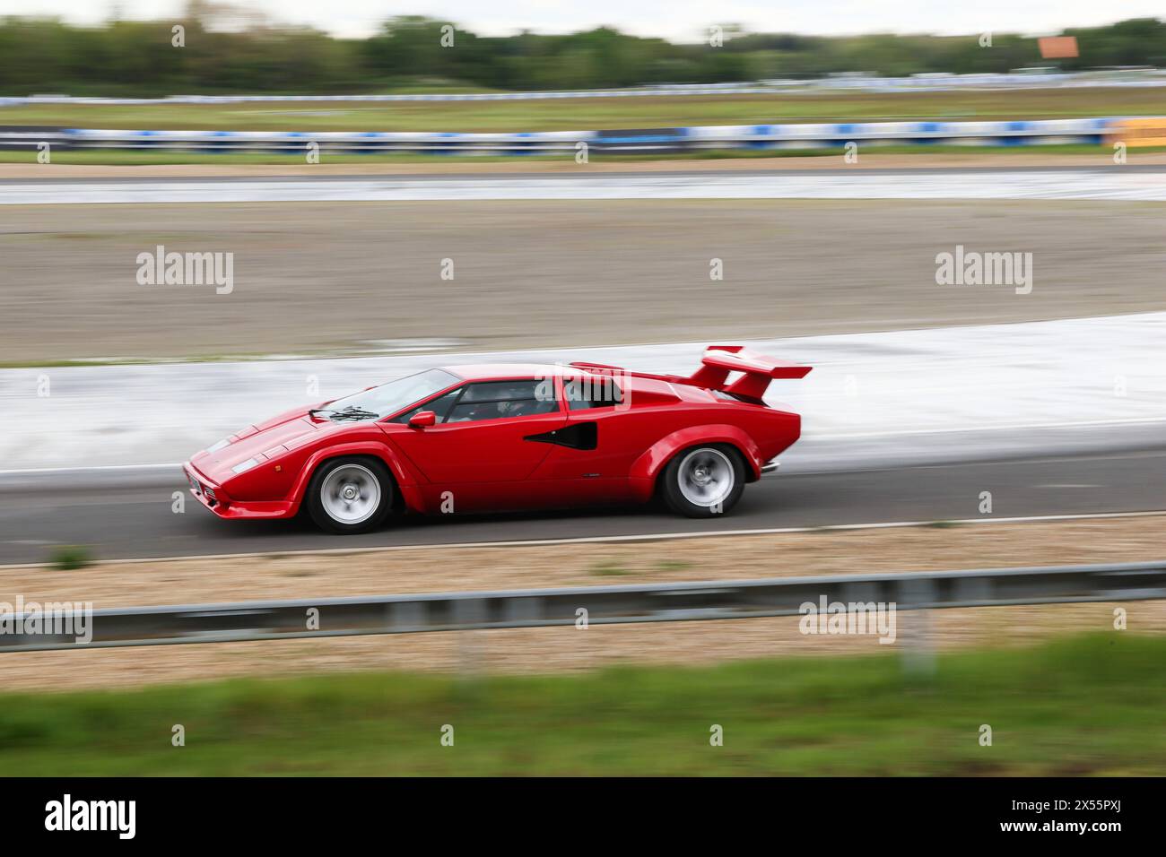 Lamborghini Countach driving around track at Italian Car Day at ...