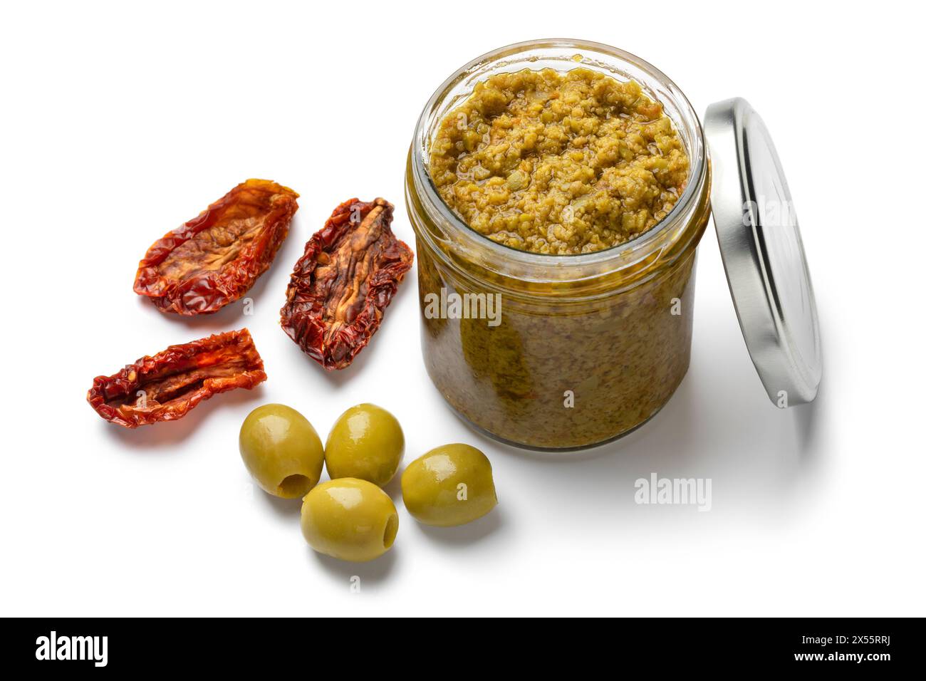 Glass jar with traditional homemade green olive tapenade close up ...