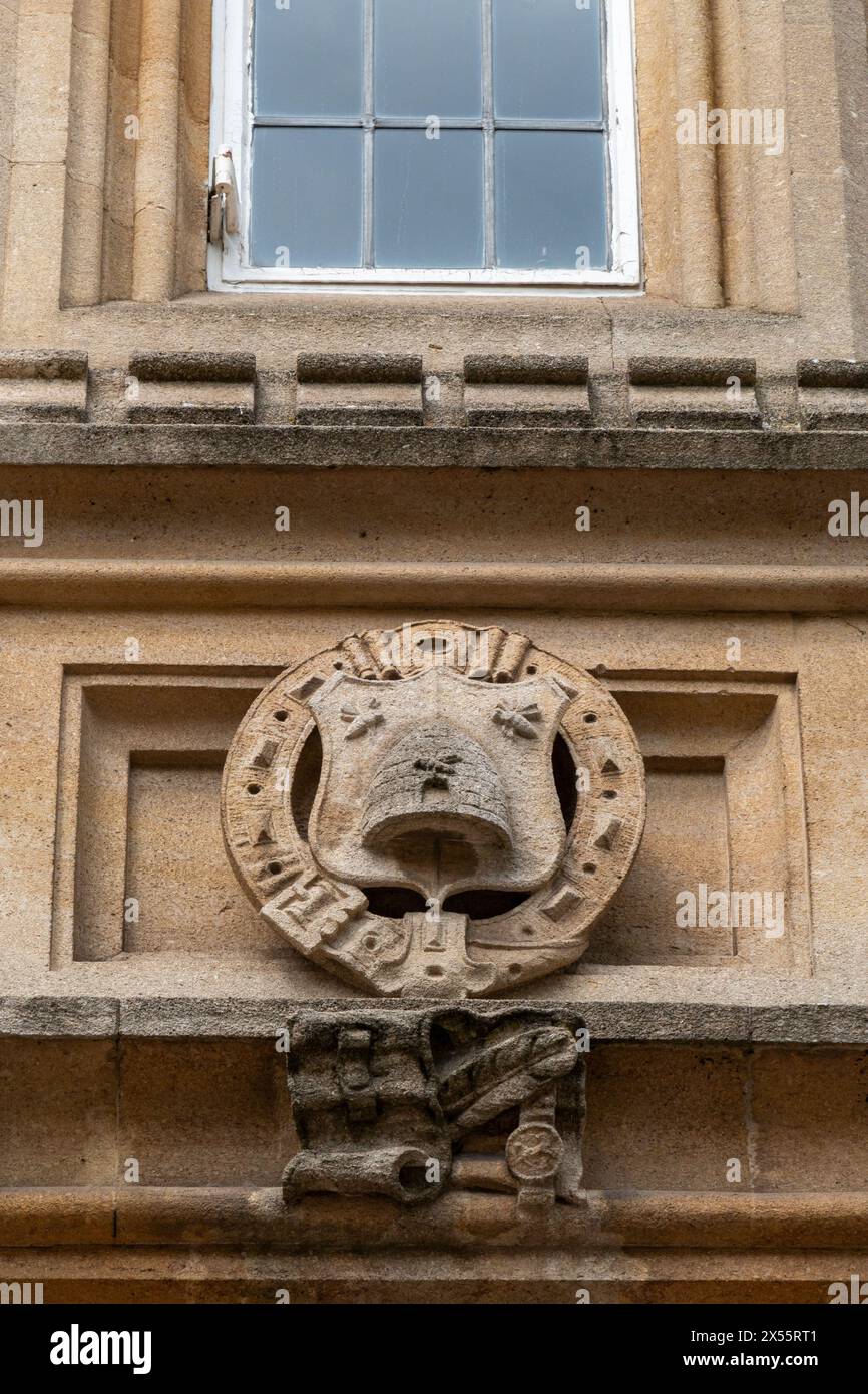 Detailed stone carving of a shield with bee and beehive detail on the ...