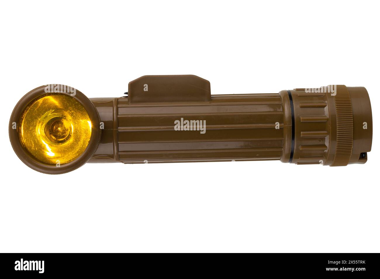 vintage military style flashlight with yellow light isolated on white ...