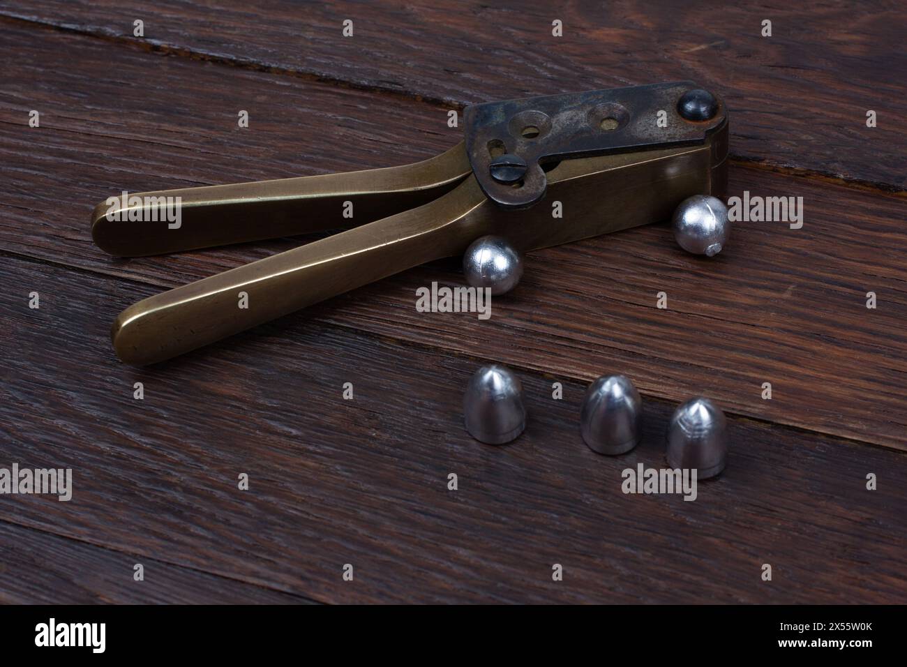 old west bullet mold with bullets for revolver. Isolated on white ...