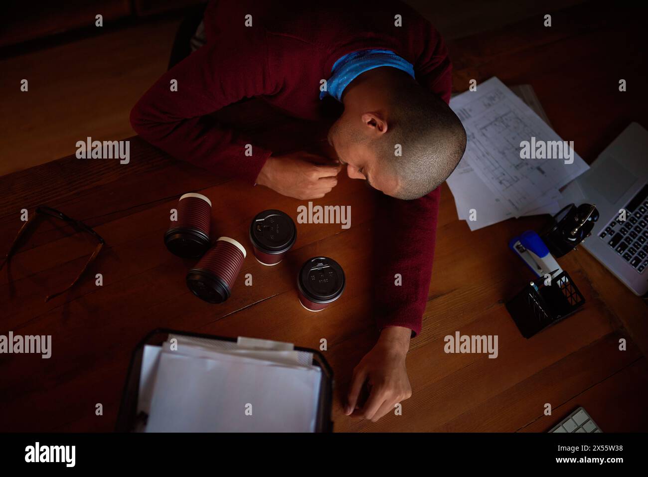 Burnout, tired or businessman man sleeping on documents with coffee in ...