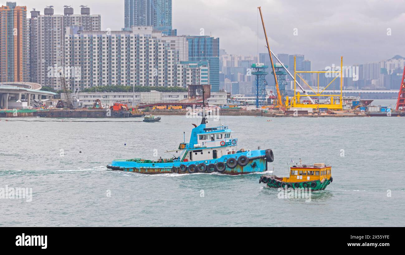 Blue Tugboat at Victoria Harbour in Hong Kong Stock Photo - Alamy