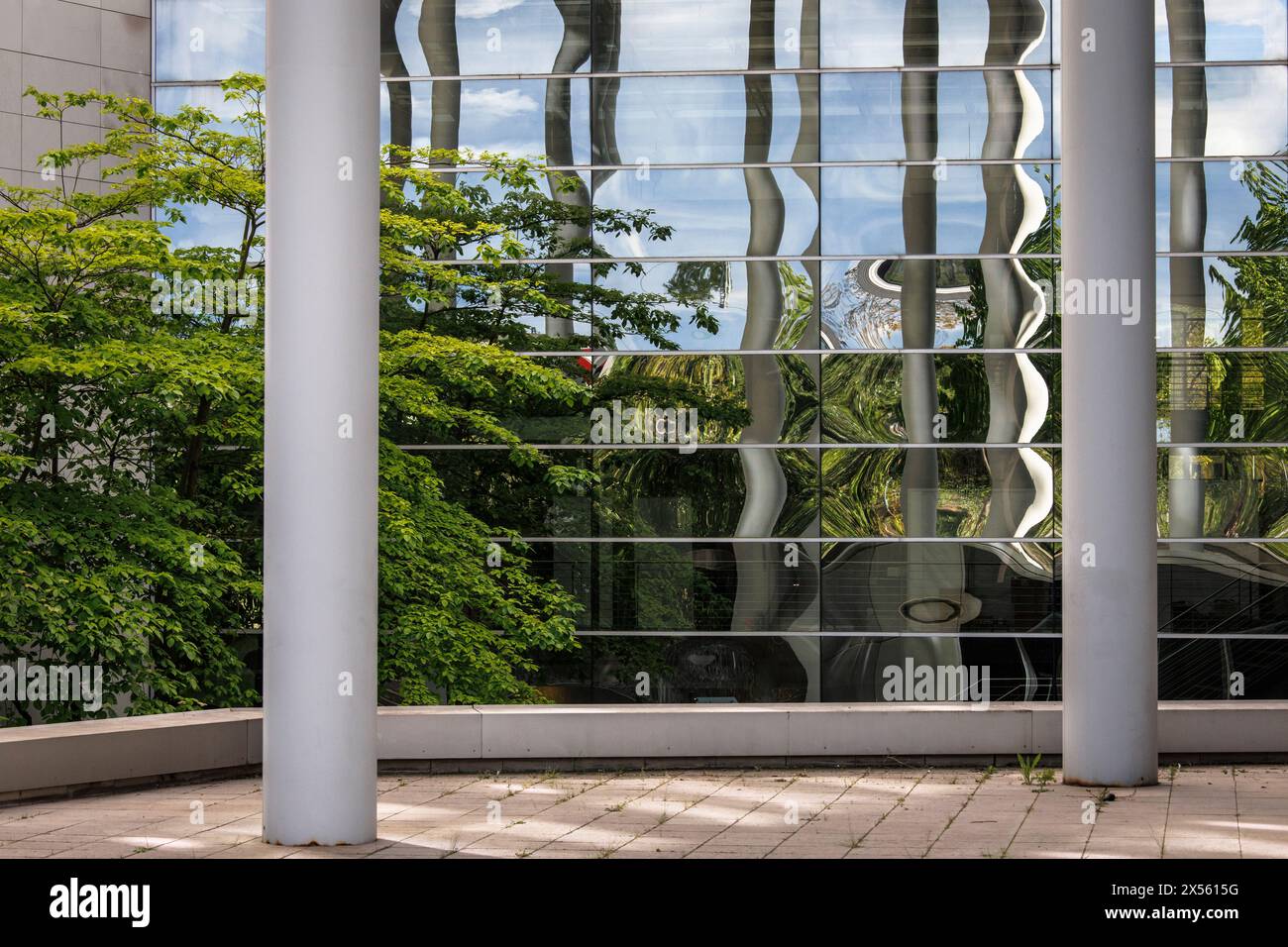 trees in the inner courtyard of an office and business building in ...