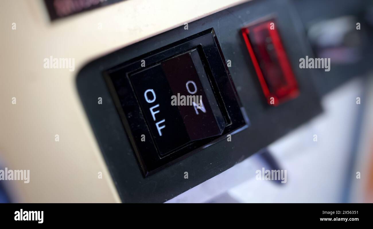 Close-up view of an analog on-off switch in the off position, with a ...
