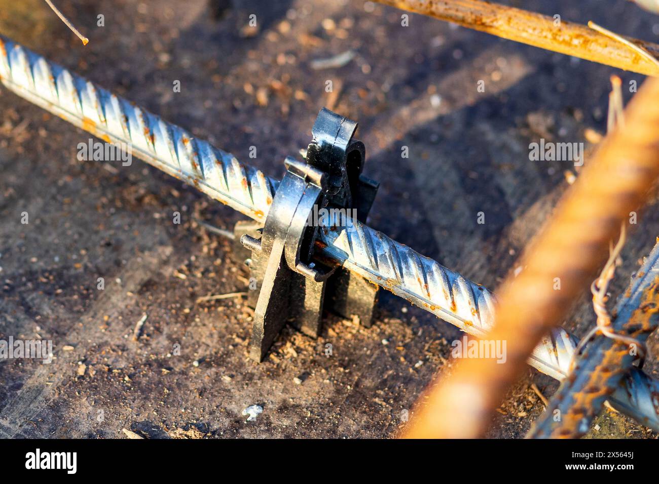 Black plastic reinforcing bar supports are used as accessories for ...