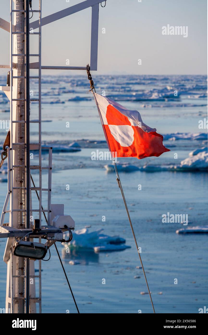 Flag of Greenland flying from a ships mast in the Arctic Ocean Stock ...