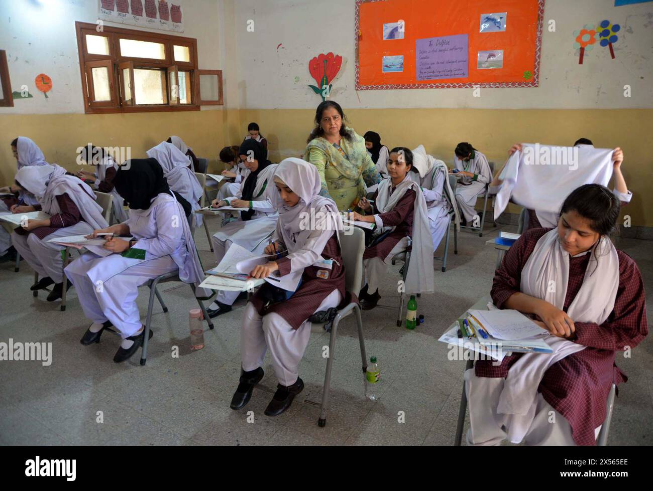 Karachi, May 7, 2024.Students of SSC Part 1 are solving their paper at ...