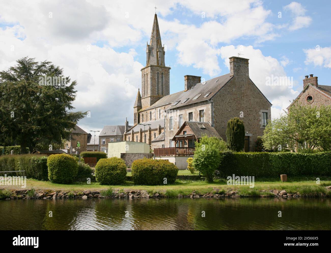 A view of Mantilly from across the lake, Orne, Normandy, France, Europe ...