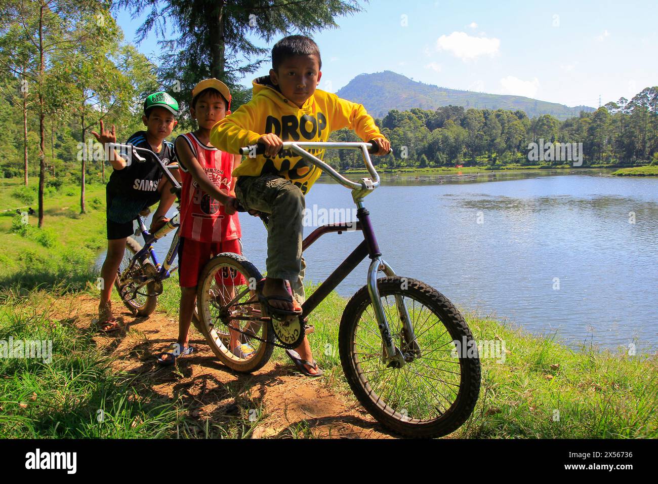 Children utilize the lake area Cisanti as a playground. Cisanti lake is ...