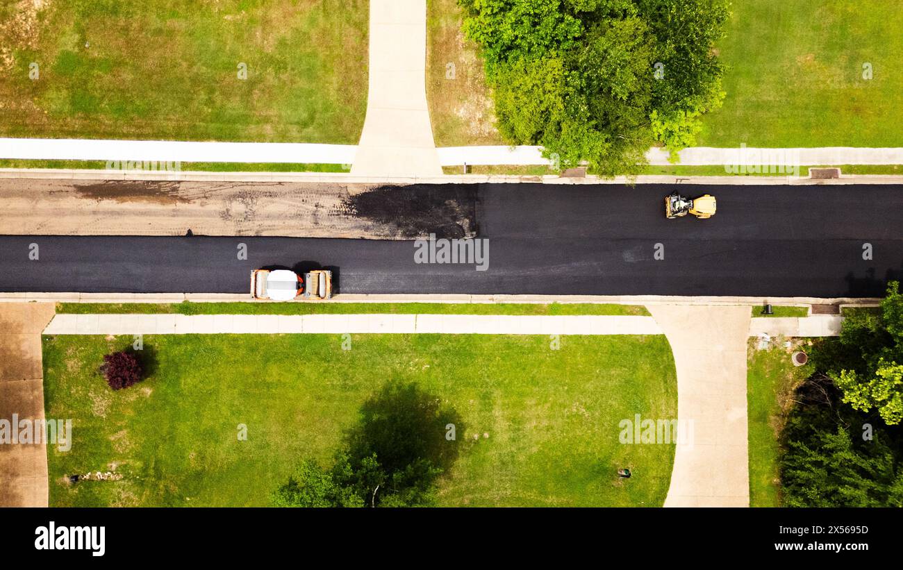 Overhead view of road getting a new asphalt surface Stock Photo - Alamy