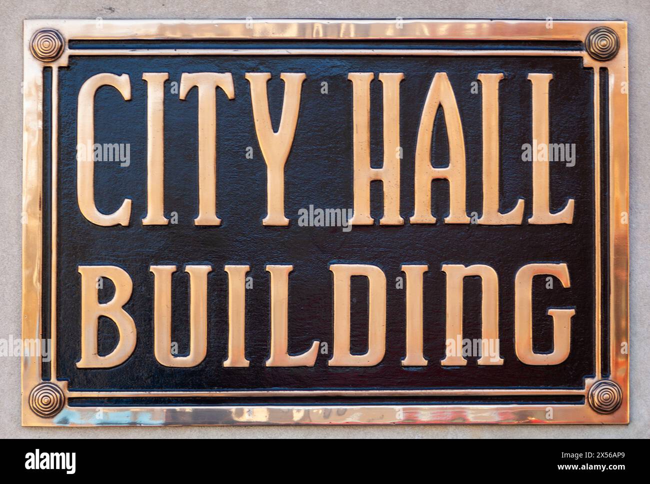 A bronze City Hall plaque on a building Stock Photo - Alamy