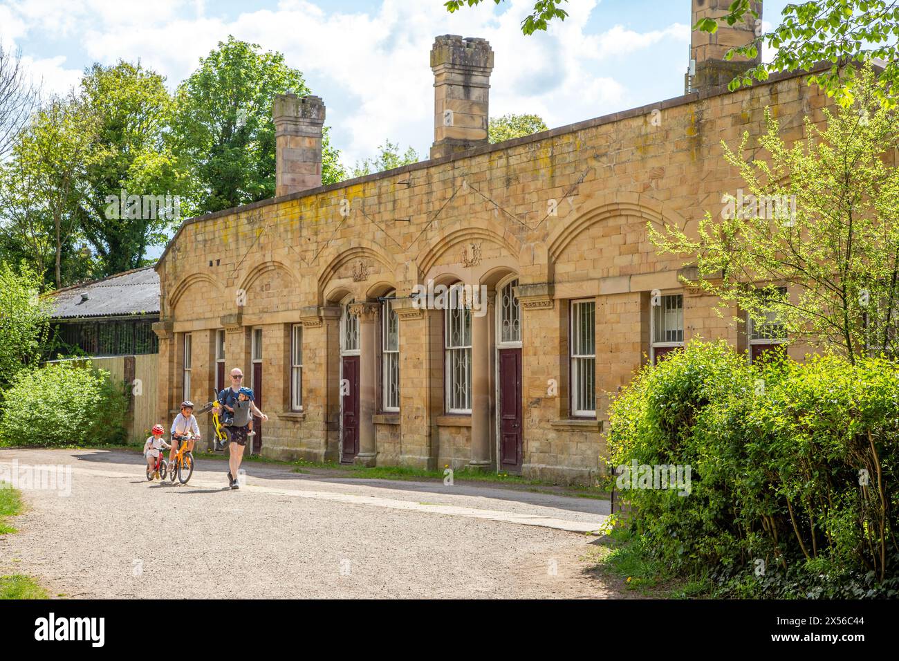 Family walking rambling hiking past the former station building at ...