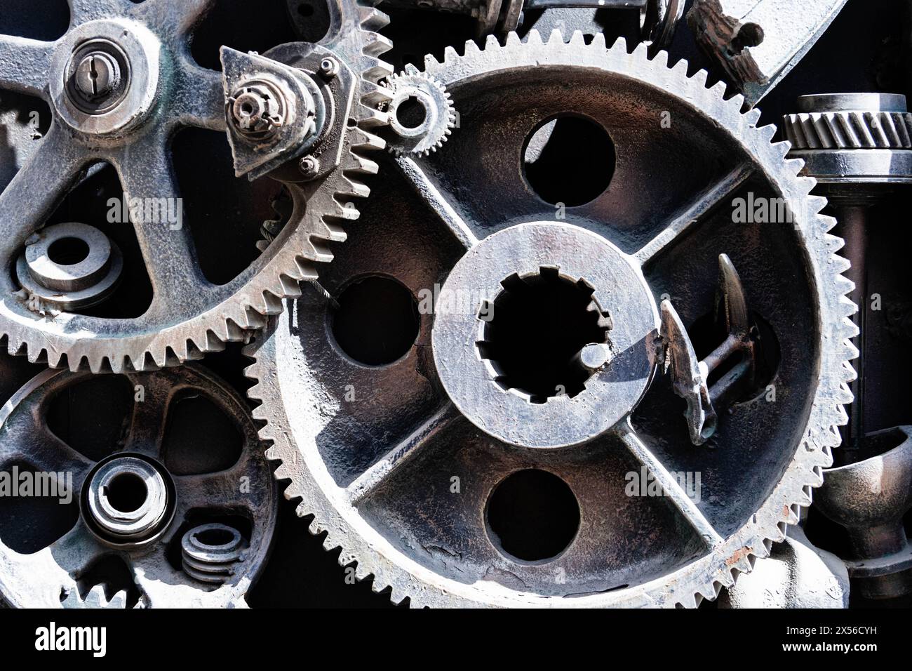 Metal gears background. Old and rusty spare parts for industrial ...