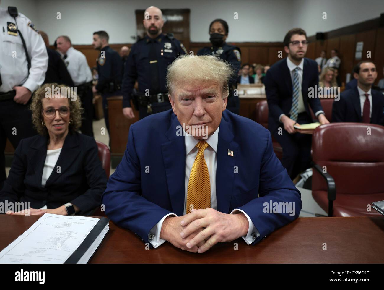 Former President Donald Trump is seated as he attends his trial at ...