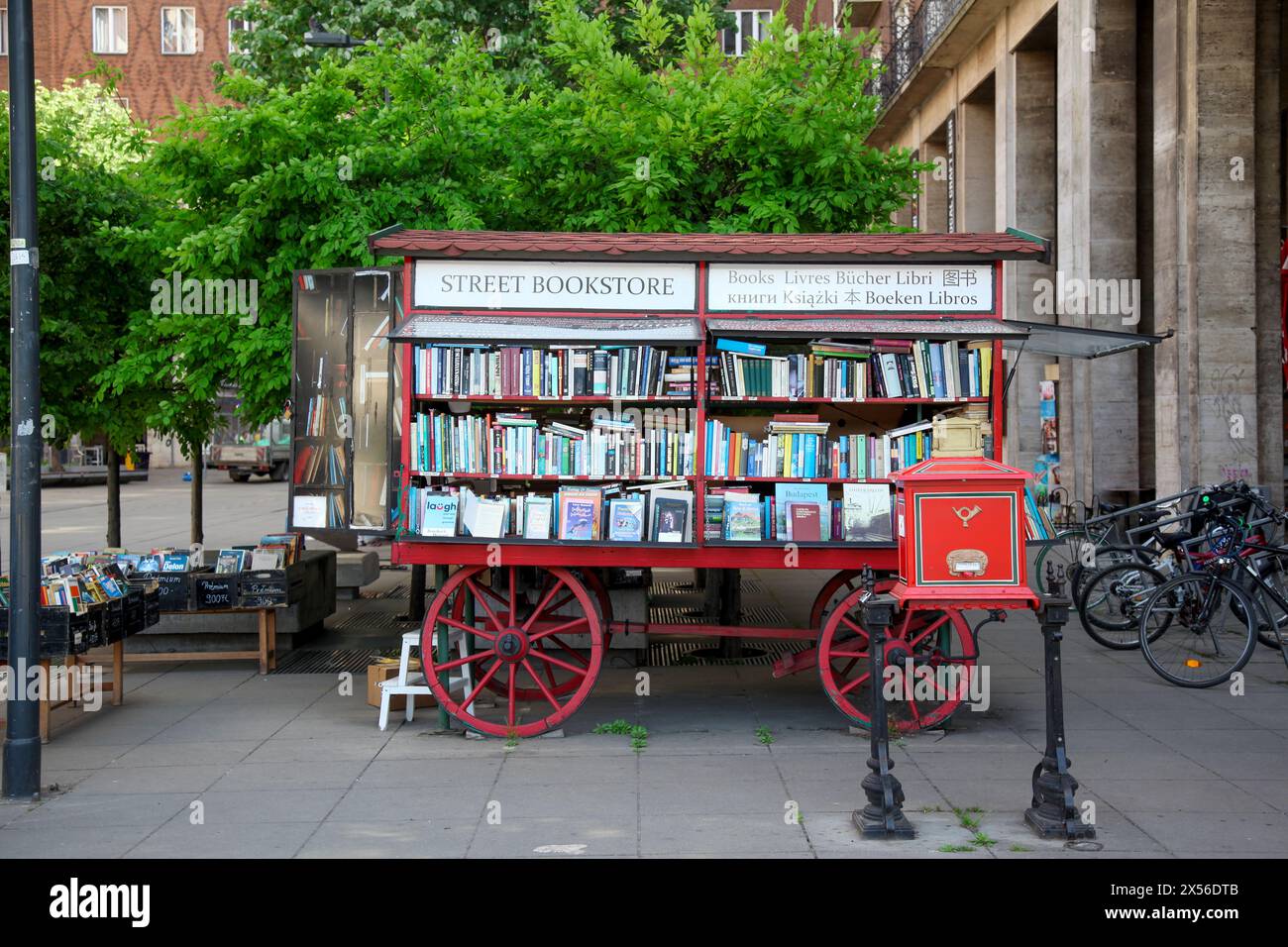 Street bookstore on an old wooden carriage, with books in several ...