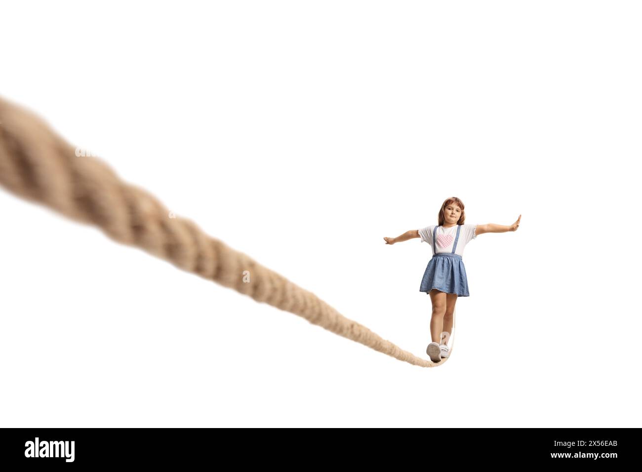 Child walking on a tightrope isolated on white background Stock Photo ...
