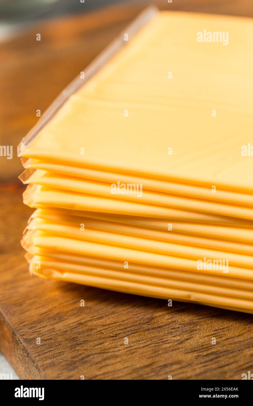 Yellow Cheddar American Cheese Singles in a Stack Stock Photo - Alamy