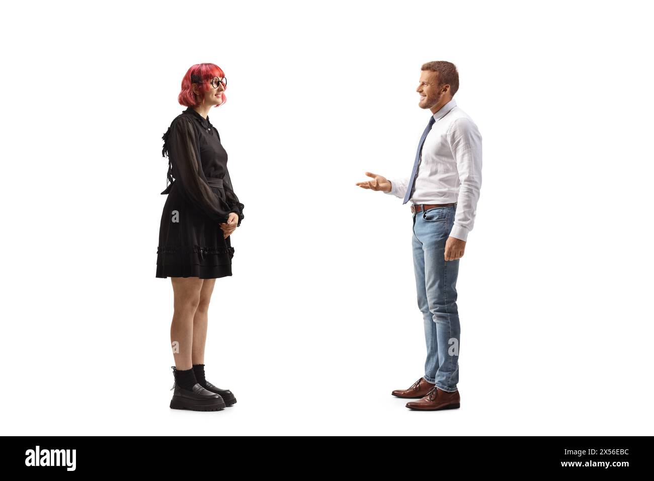 Man standing and talking to a red-haired woman in black dress isolated ...