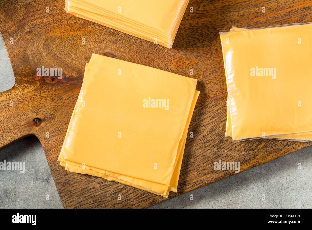 Yellow Cheddar American Cheese Singles in a Stack Stock Photo - Alamy