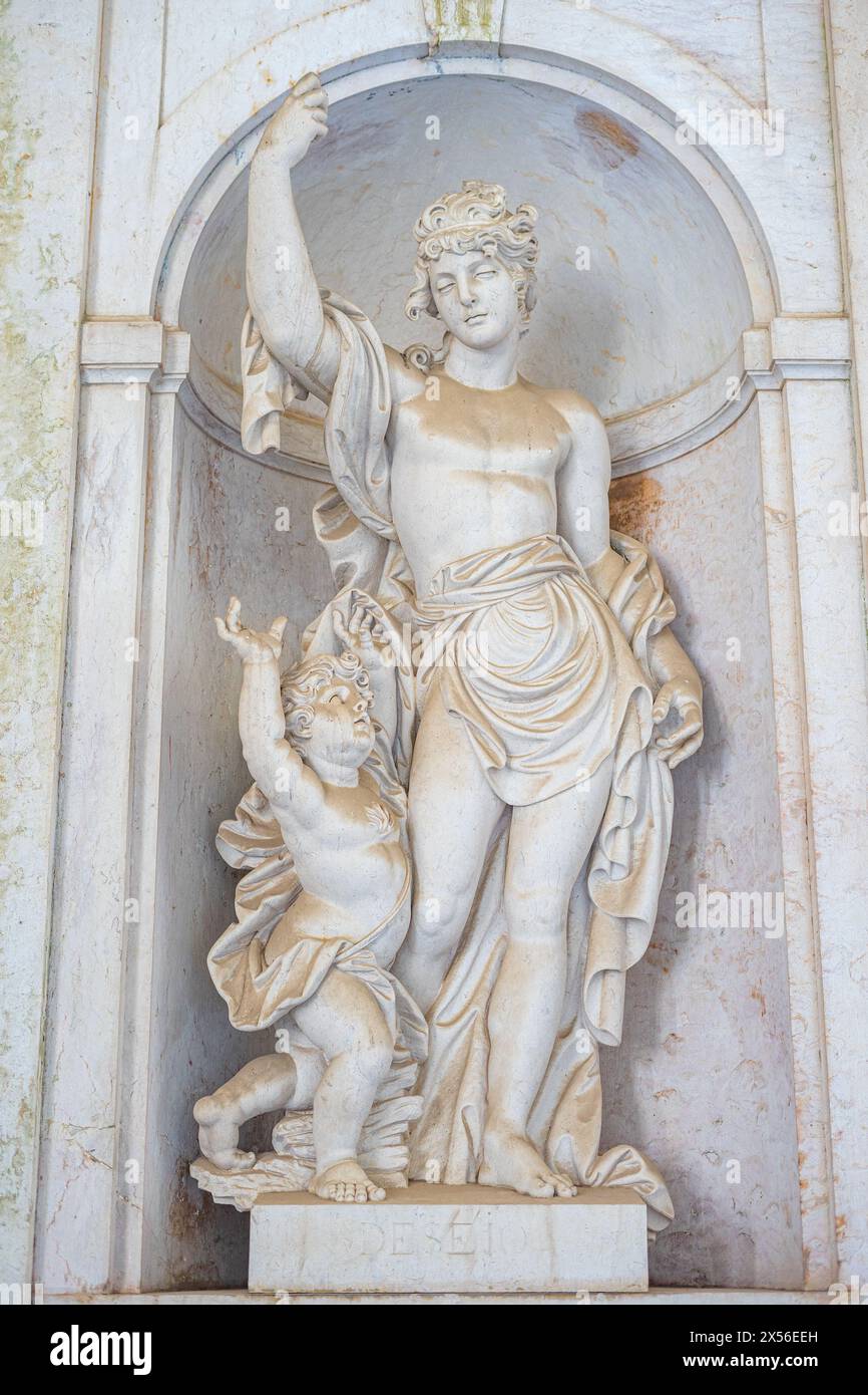 Stone statue representing desire inside the Ajuda Palace in Lisbon ...