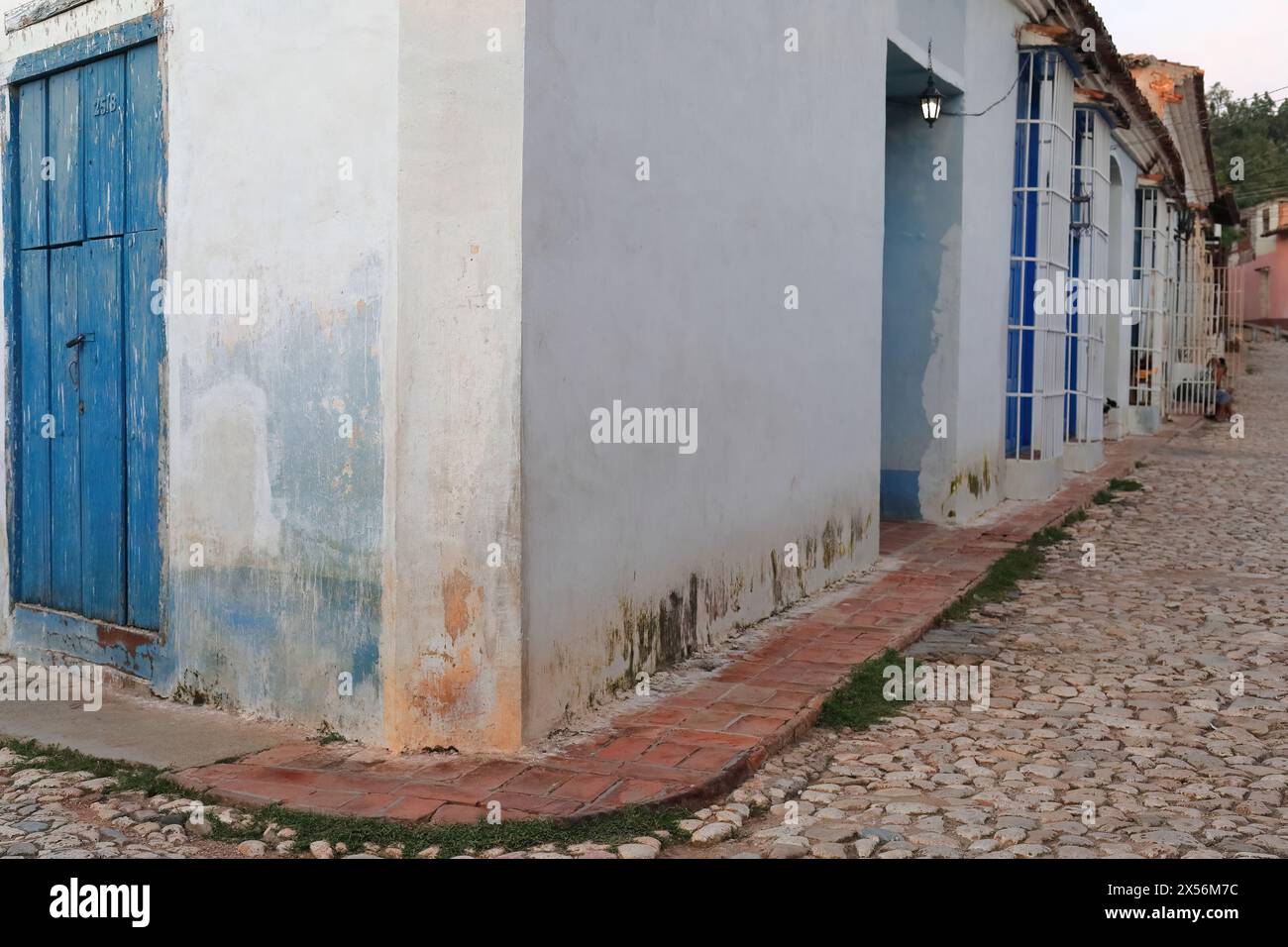 248 Peeling facade of a colonial house on an unidentified street corner ...