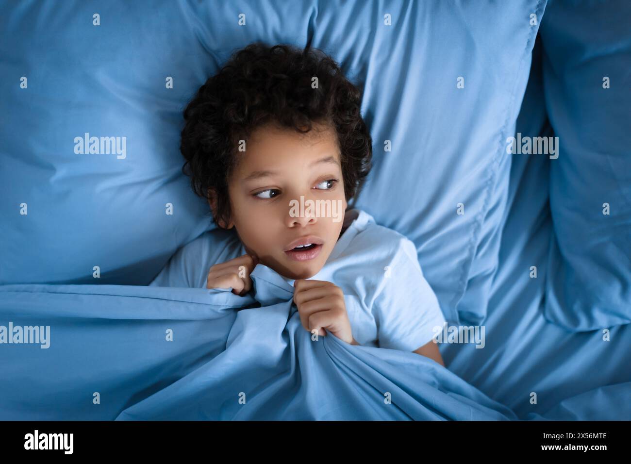 Boy scared bed black hi-res stock photography and images - Alamy