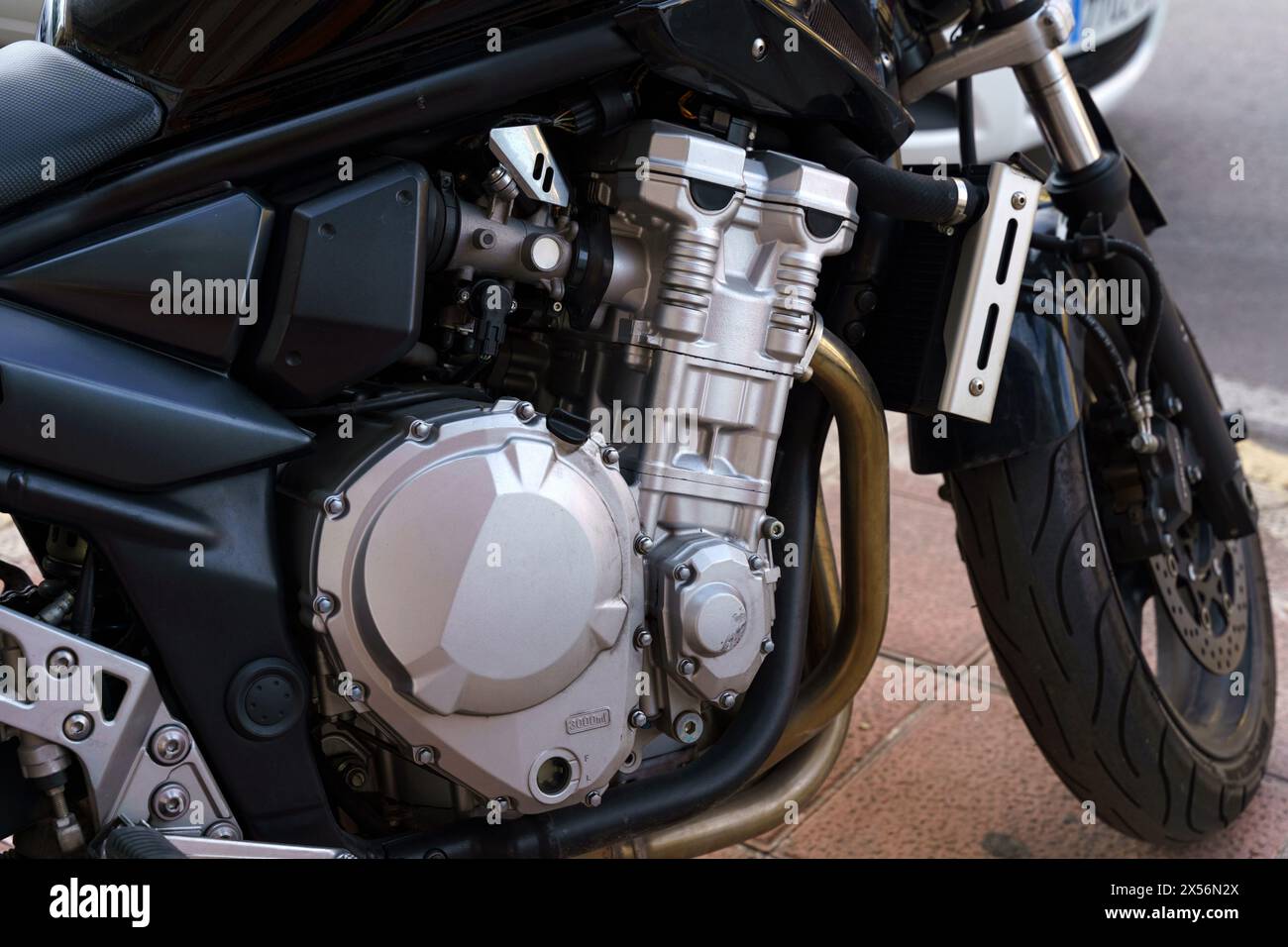 Close-up of a motorcycles engine block and exhaust pipes, showcasing ...