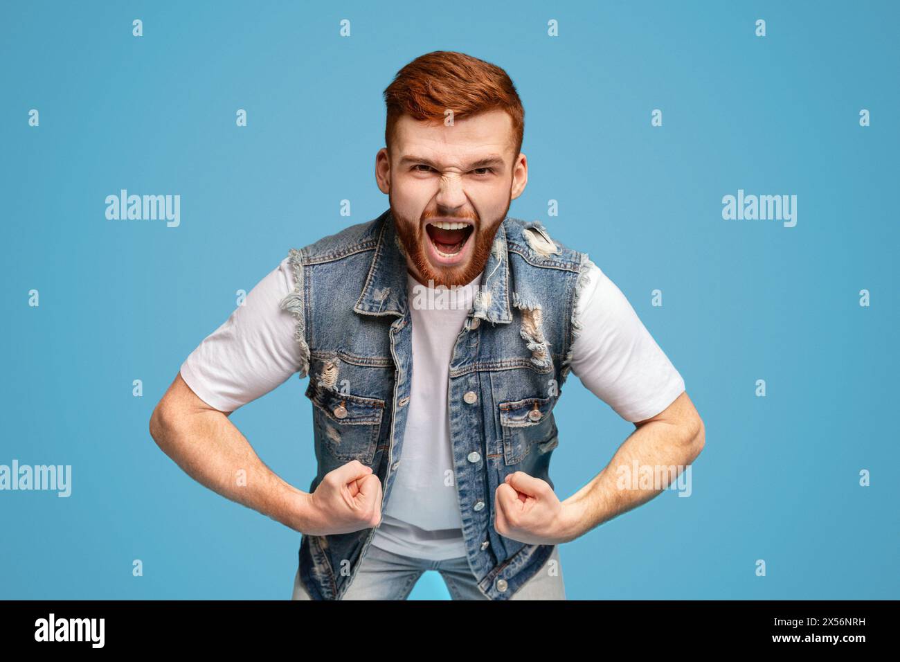Young angry muscular man screaming loud at camera Stock Photo - Alamy