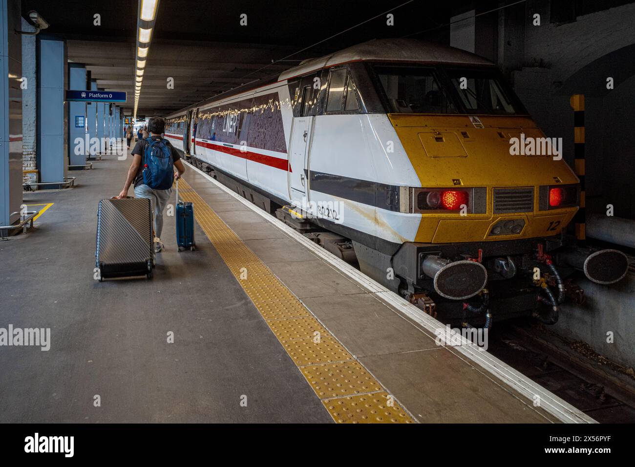 Kings Cross Station passenger catching a train from London to Leeds ...