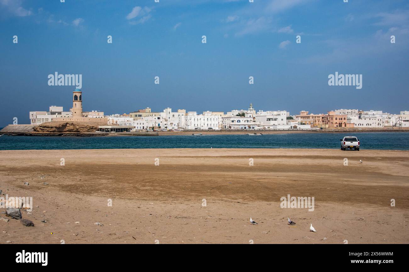 View of the old fort/watch tower and corniche from the Mutrah Harbor ...