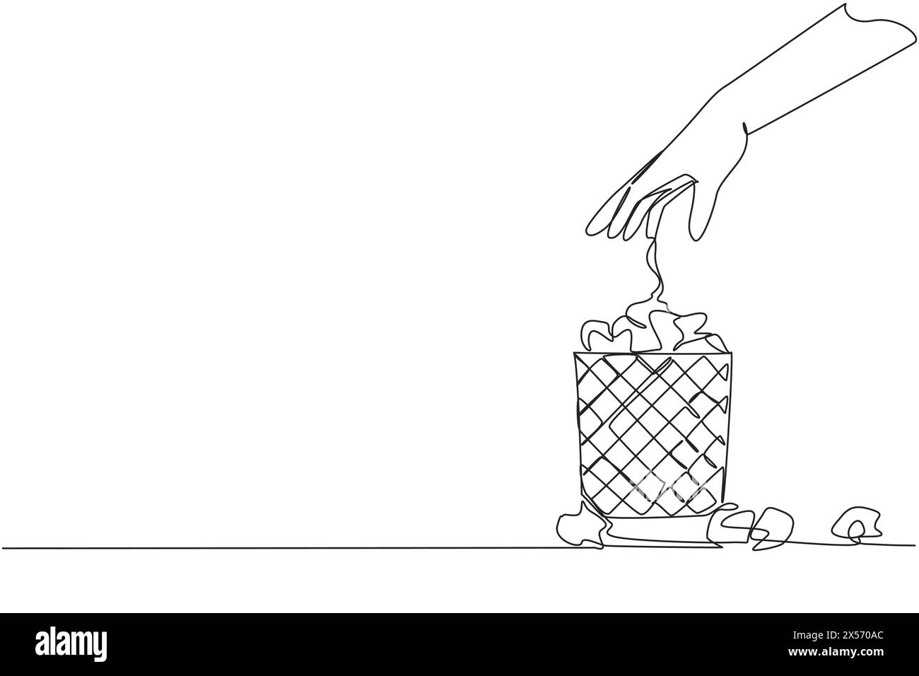 Single one line drawing hand throws wadded paper into wire mesh trash ...