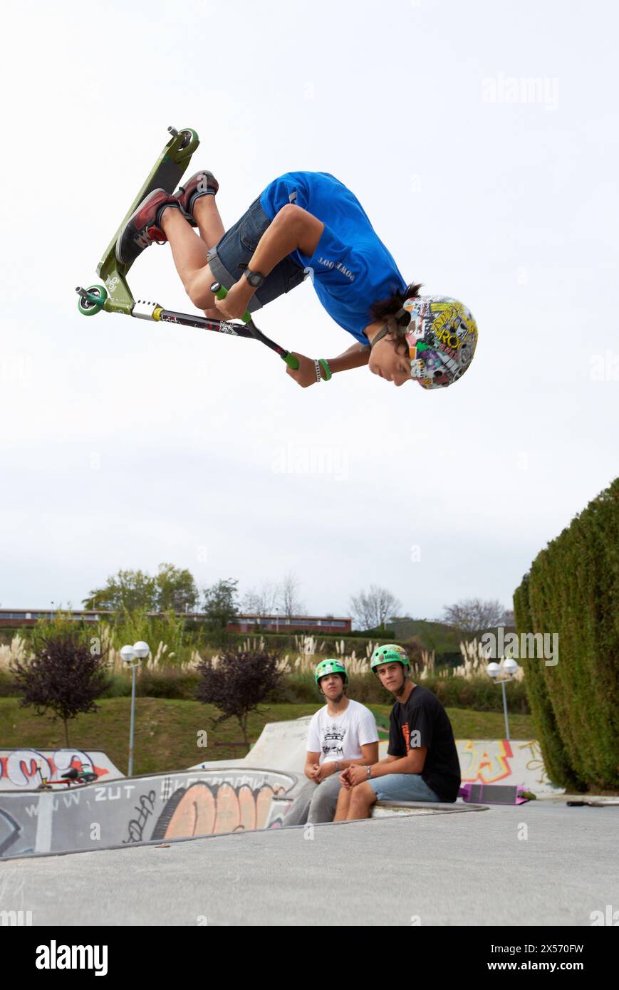 Teenager with city scooter in Skate park, Leioa, Bizkaia, Basque ...