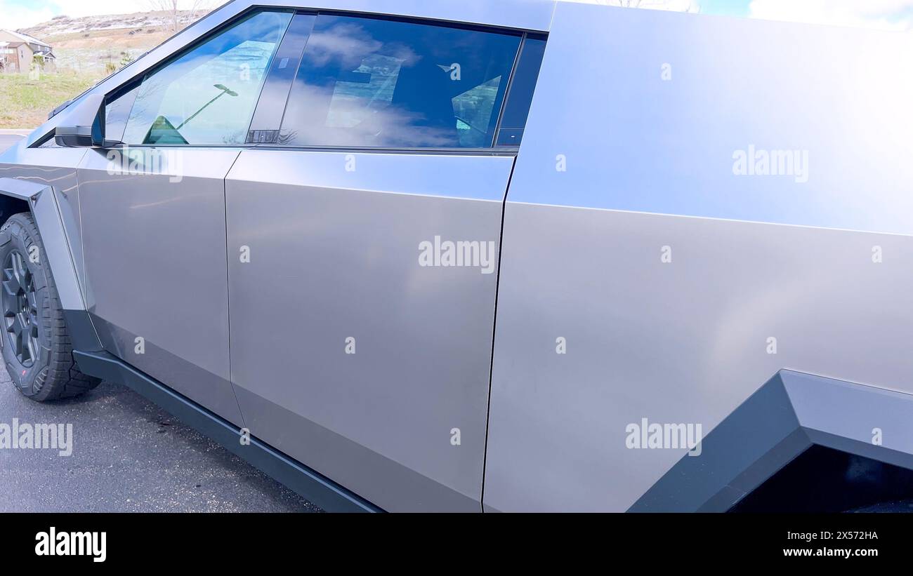 Sleek Tesla Cybertruck Parked in a Suburban Neighborhood Stock Photo ...