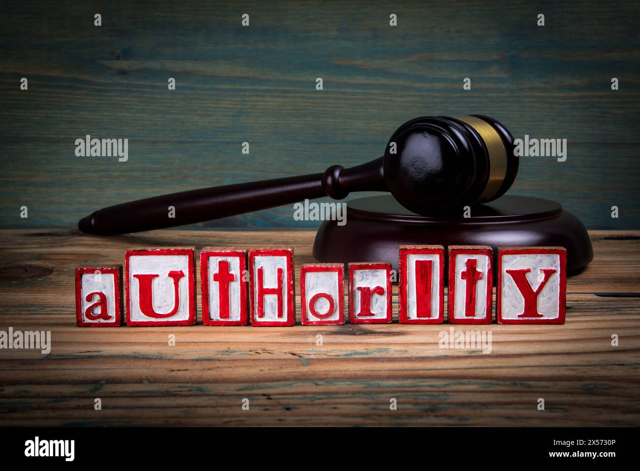 AUTHORITY. Red alphabet letters and judge's gavel on wooden background ...