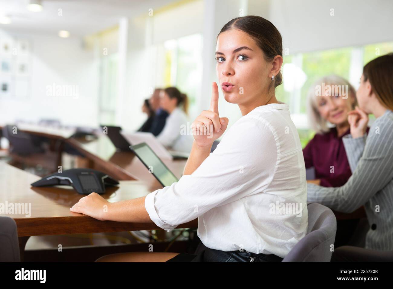 Businesswoman making quiet sign hi-res stock photography and images - Alamy