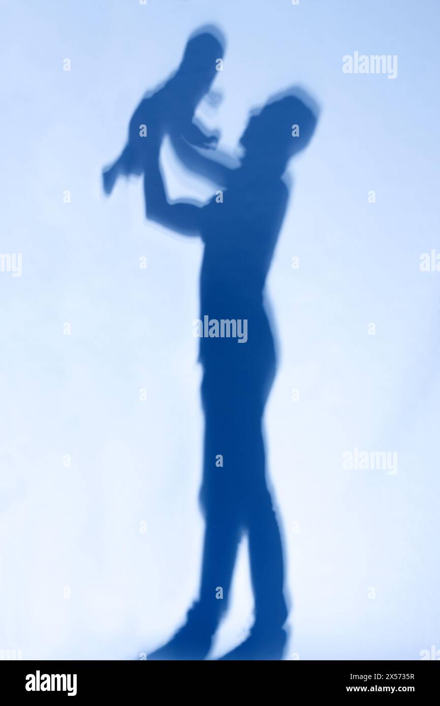 Shadow, Father with baby Stock Photo - Alamy