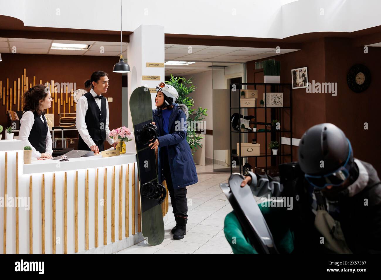 Check in desk guest services woman female employee staff hi-res stock ...