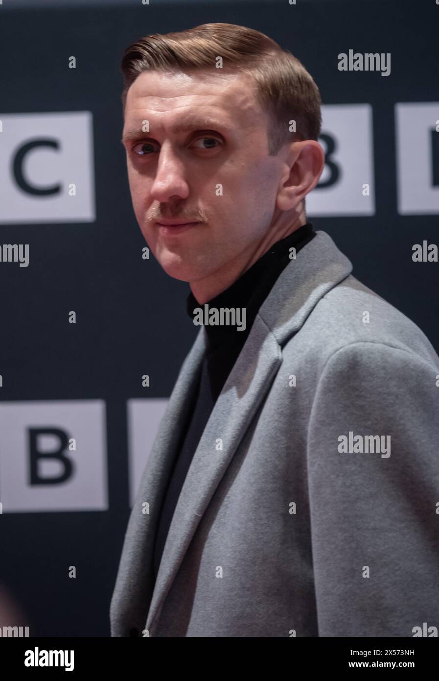 Phil McGuiness Poses on the red carpet before the Press Line event ...