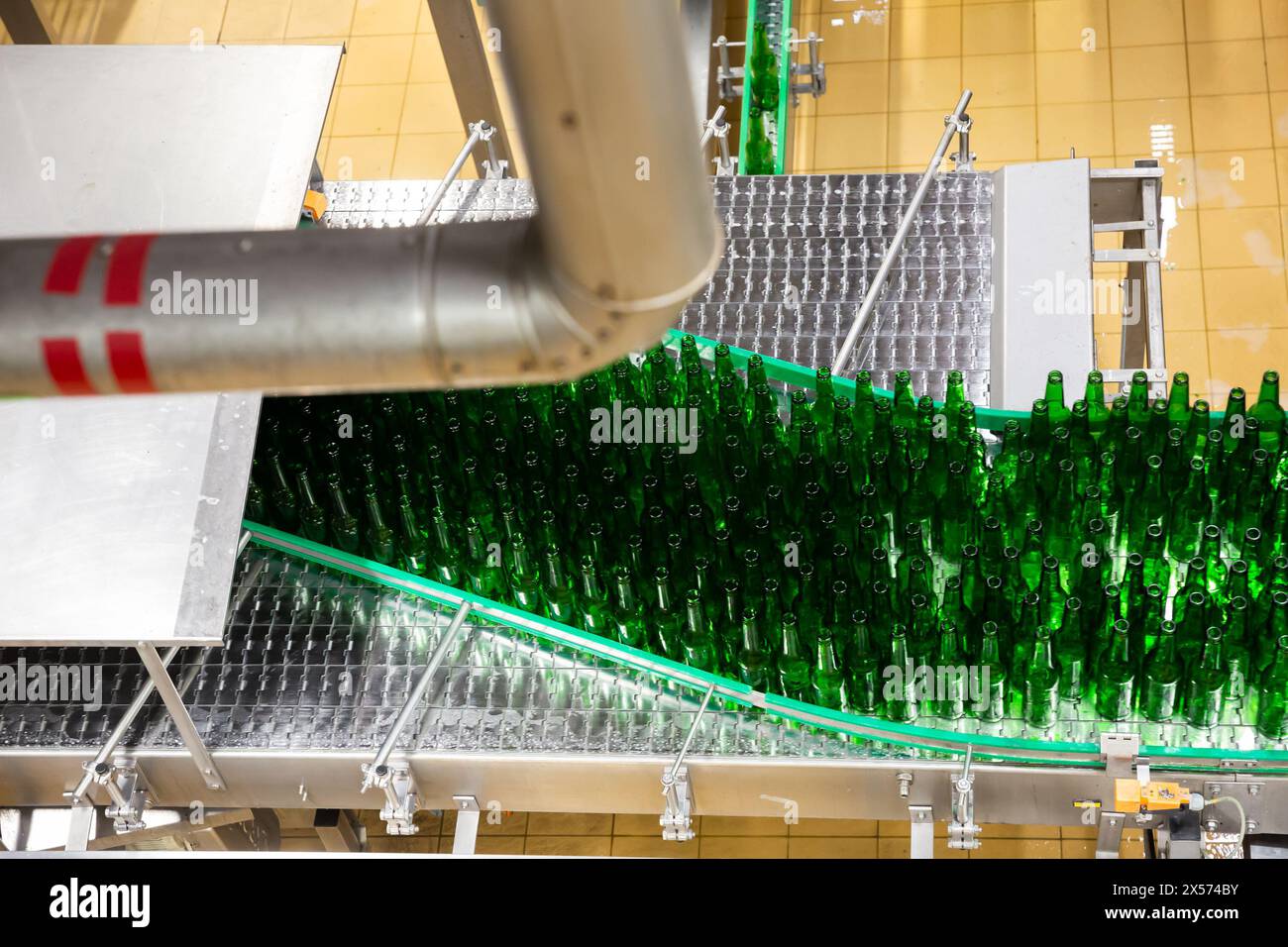 Bottles of beer on bottling line Stock Photo - Alamy