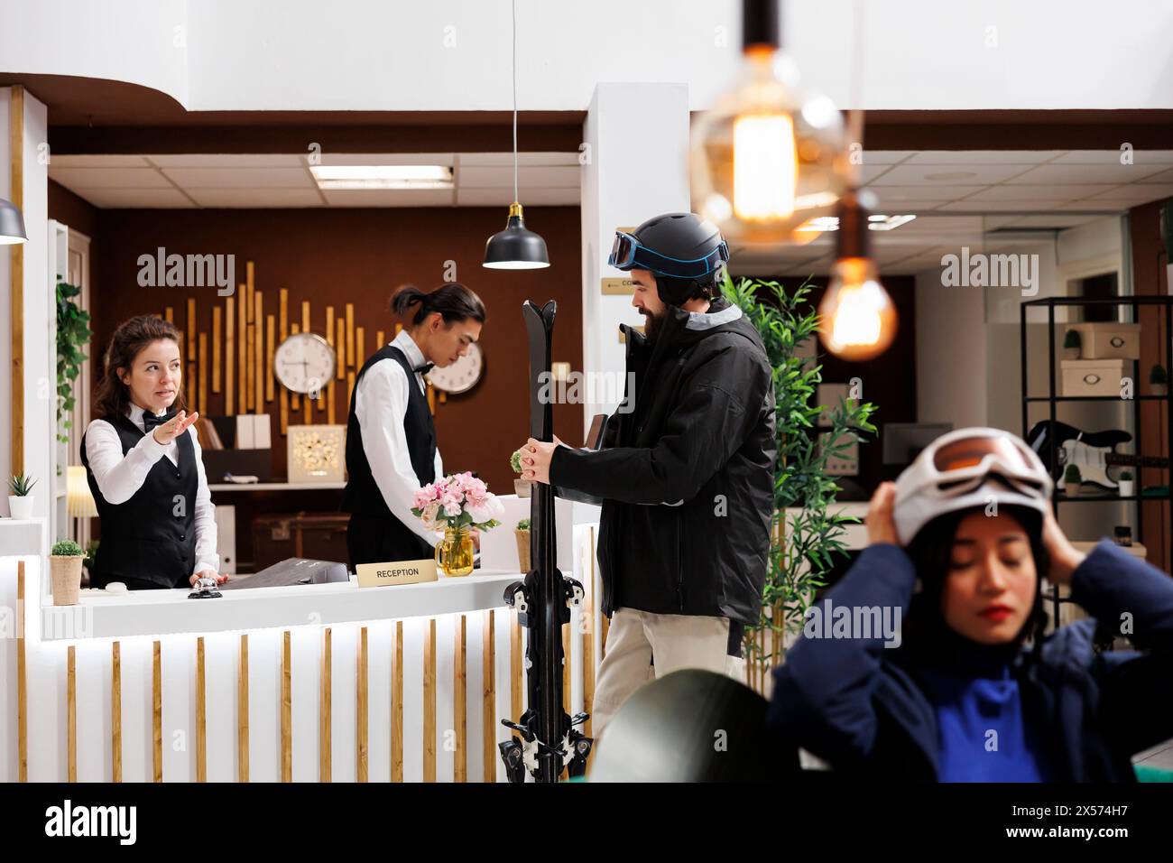 Female guest with helmet waits in luxurious lounge area ready for ...